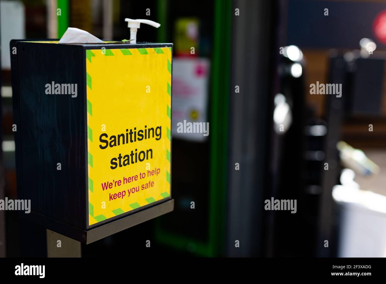 A hand sanitizing station outside of a shop to sanitize hands before ...