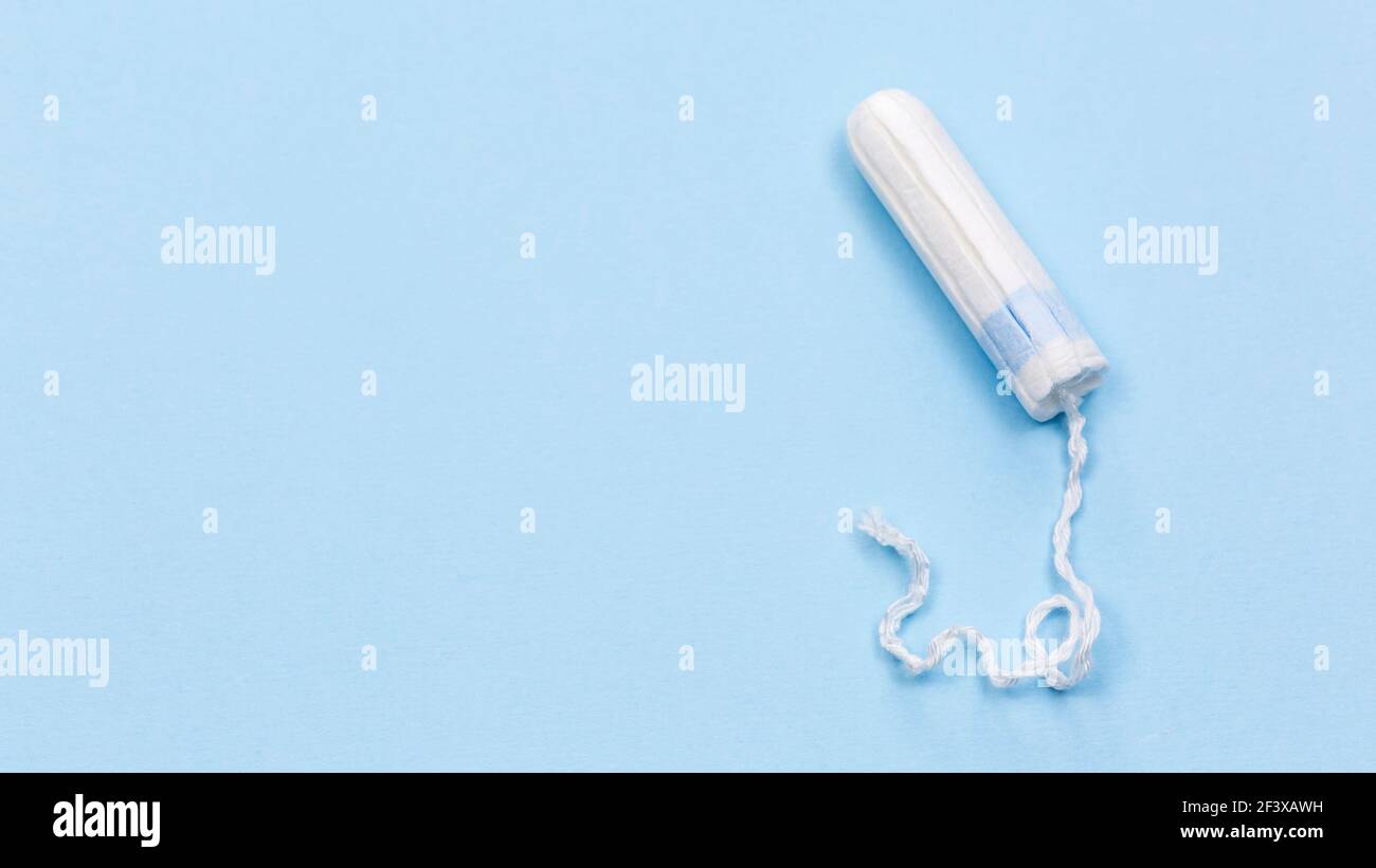 White tampon on the blue background, medical concept Stock Photo - Alamy
