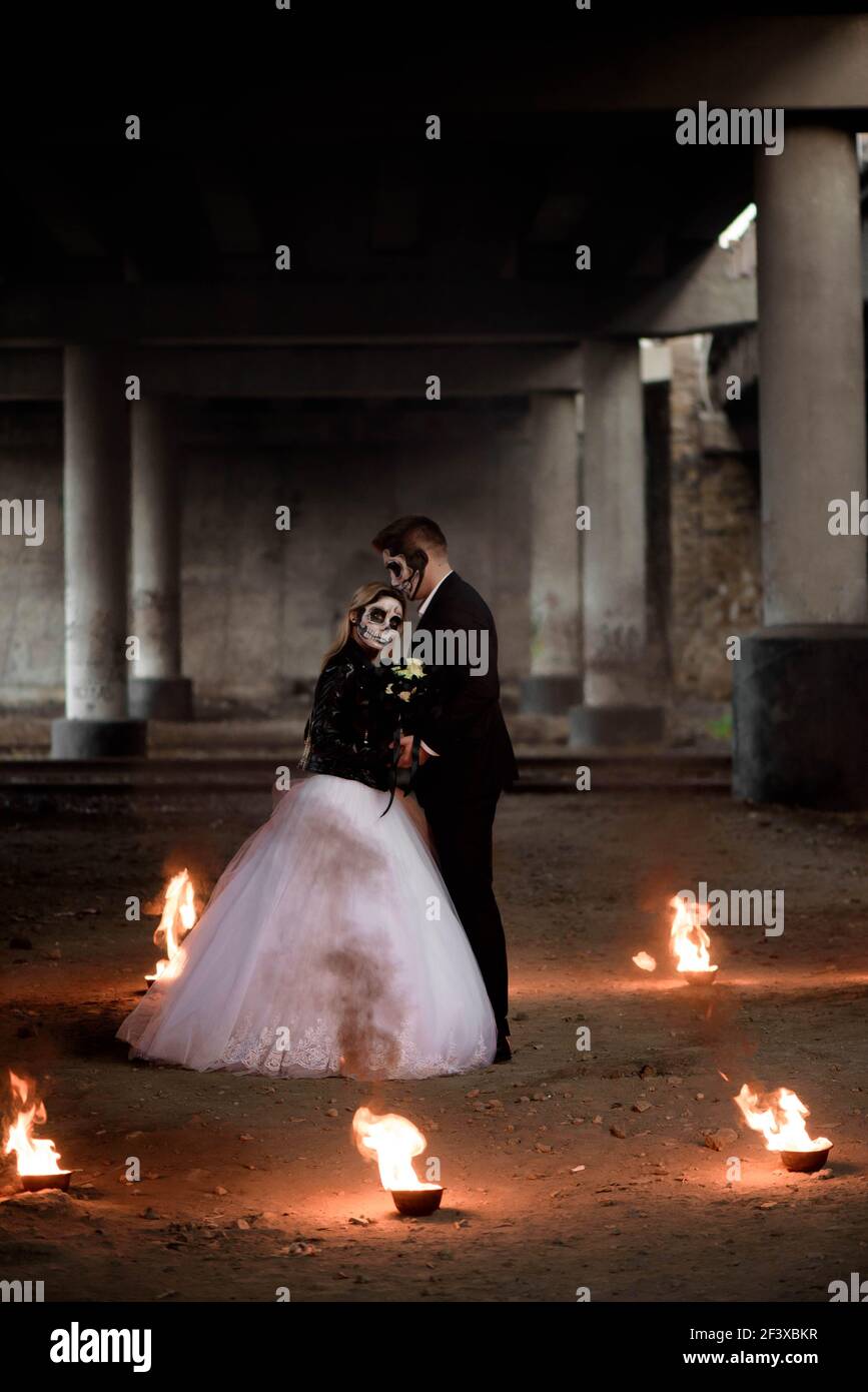 Dressed in wedding clothes romantic zombie couple Stock Photo - Alamy