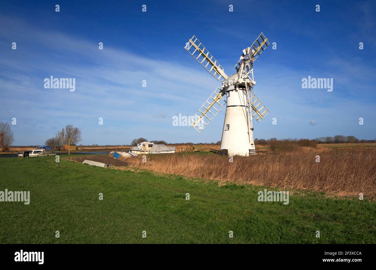 A view of Thurne Dyke Drainage Mill by Thurne Dyke and the River Thurne ...