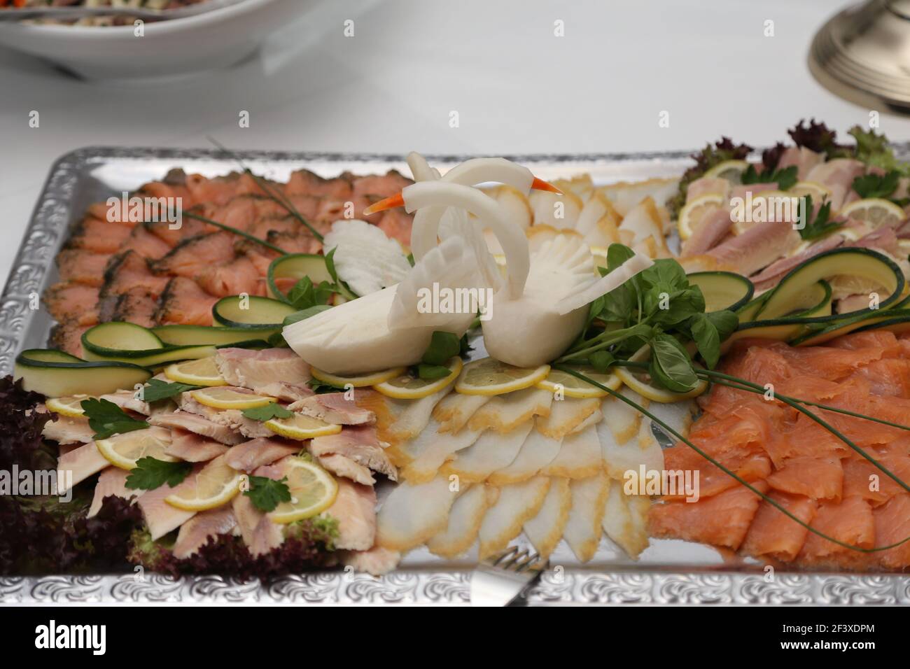 A serving of cold cuts with food-carved swan decorations Stock Photo ...