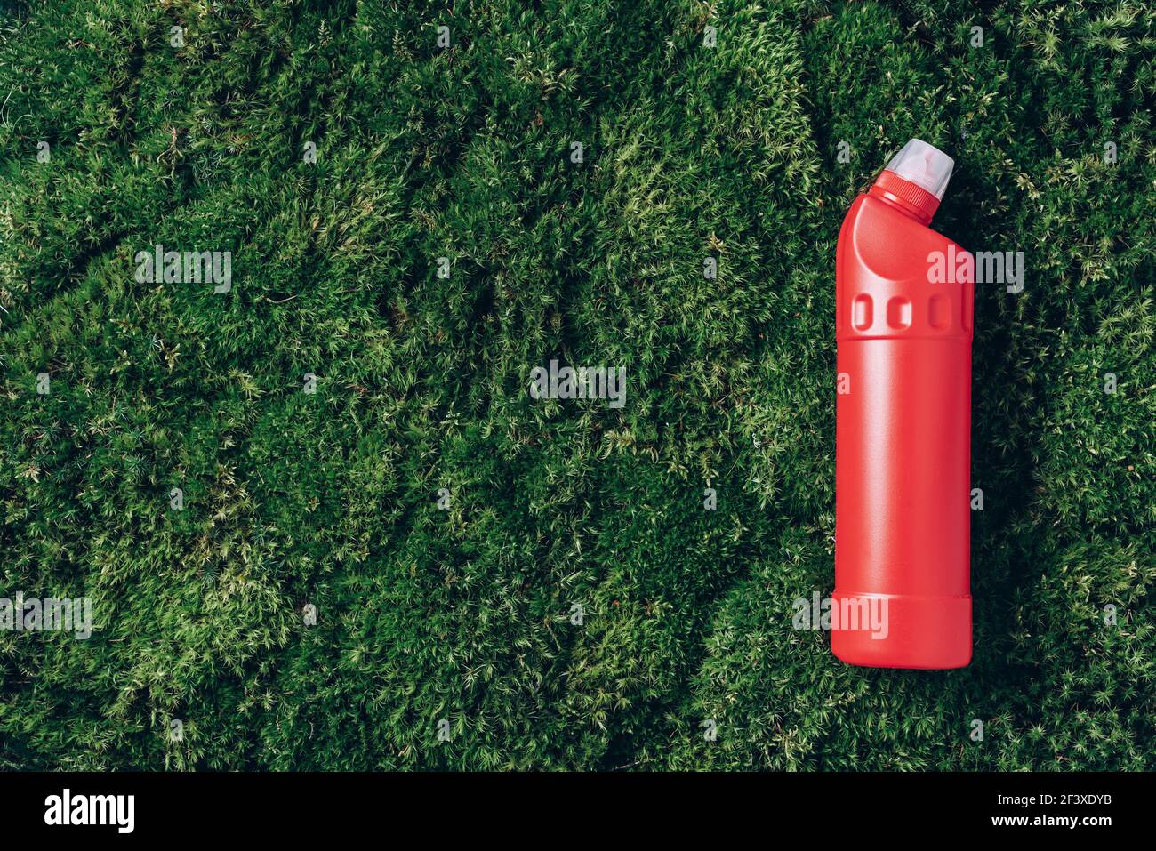 Red plastic bottle of cleaning product, household chemicals or liquid ...