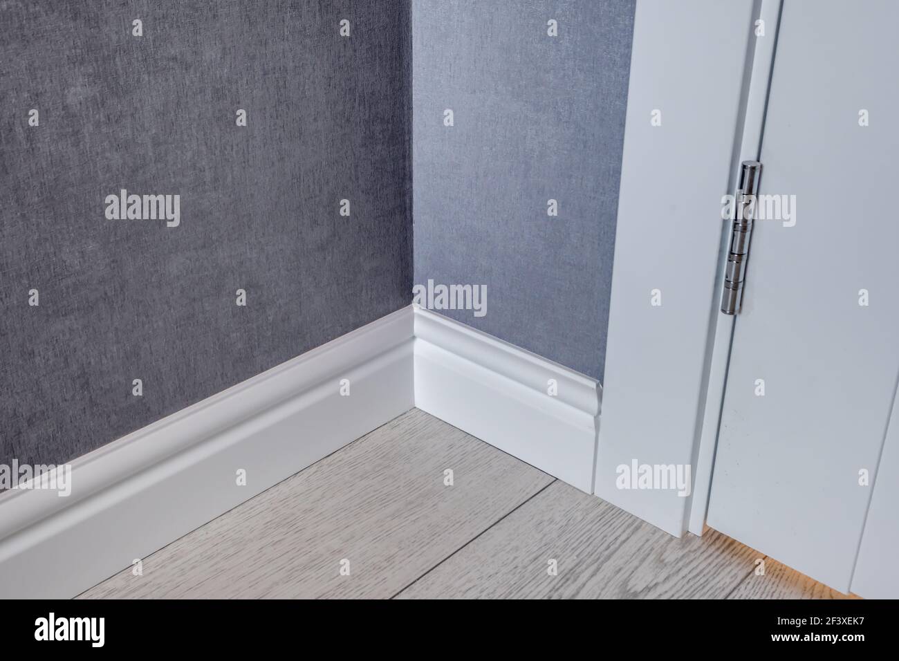 Detail of corner flooring with intricate crown molding and plinth Stock ...