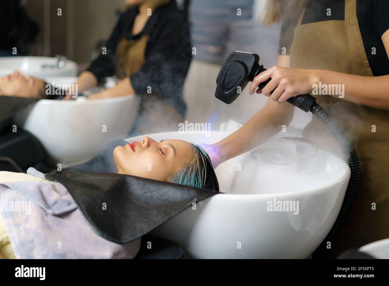 Hairdresser is using Nano Mist Hair Treatment Streamer Machine, Modern ...