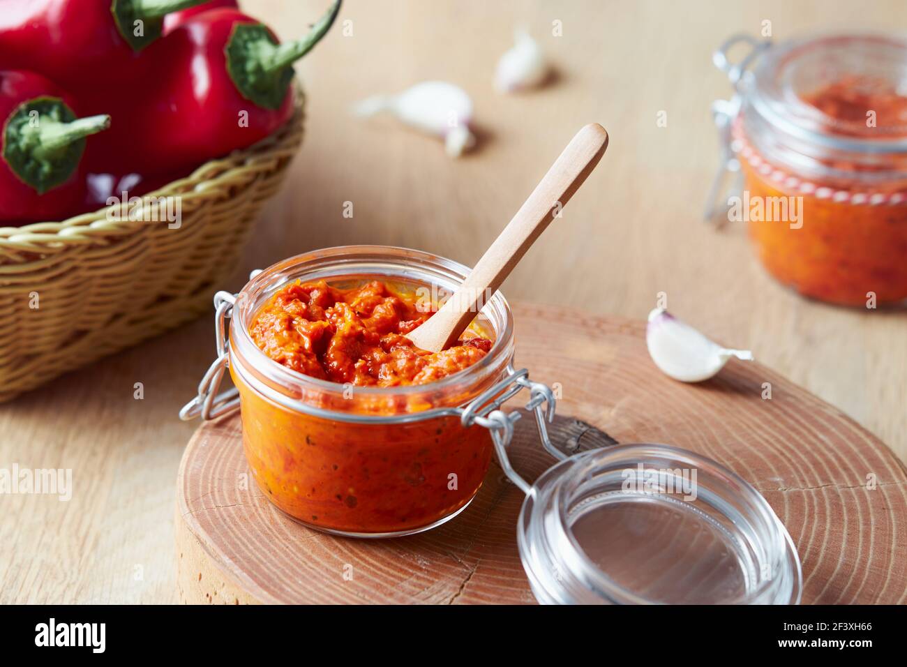 Roasted red pepper relish (Ajvar) in a jar with ingredients Stock Photo ...