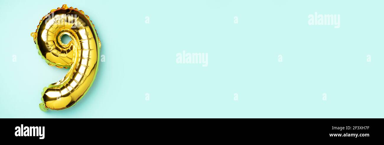 Creative layout. Golden foil balloon number and digit nine 9. Birthday ...