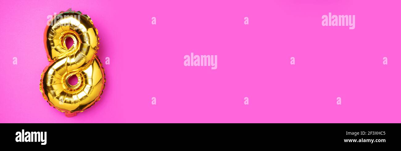 8 March. Happy Women's Day. Creative layout. Golden foil balloon number ...