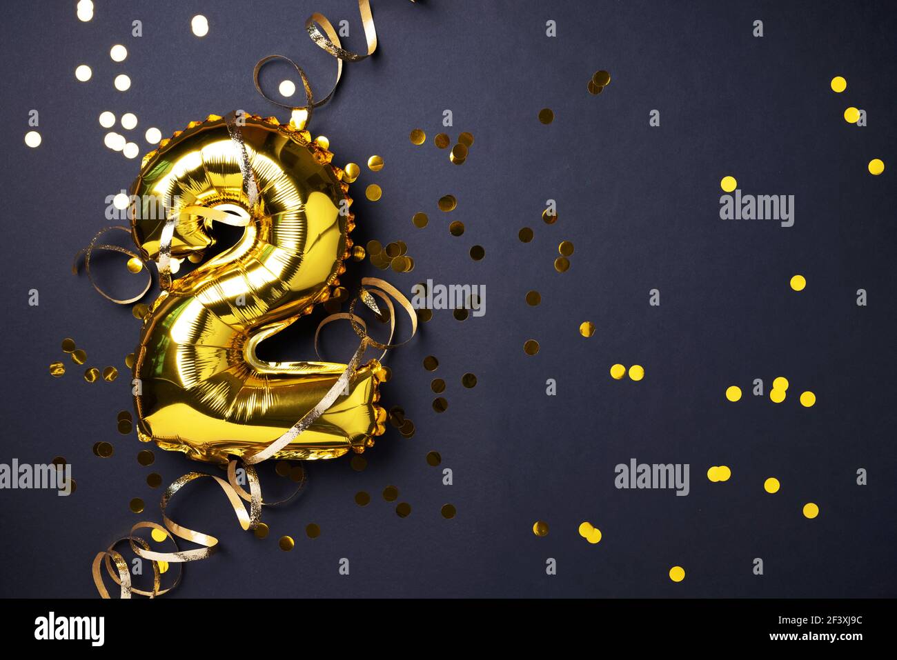 Gold foil balloon number and digit two 2. Birthday greeting card ...