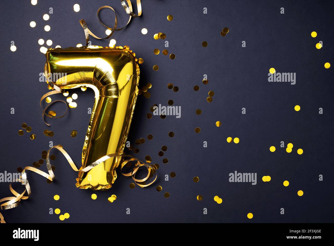 Gold foil balloon number and digit seven 7. Birthday greeting card ...