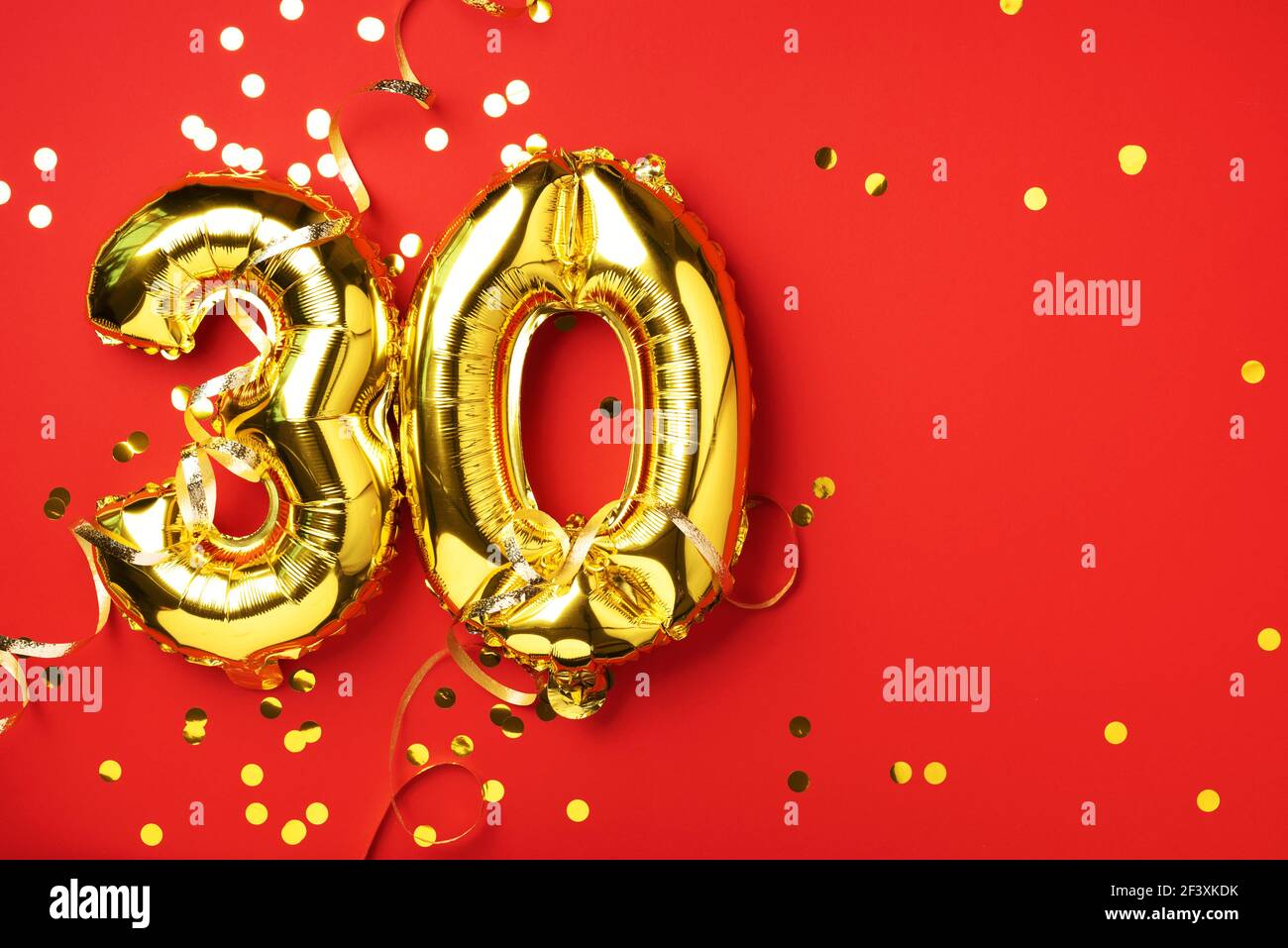 Gold foil balloon number, digit thirty. Birthday greeting card with ...