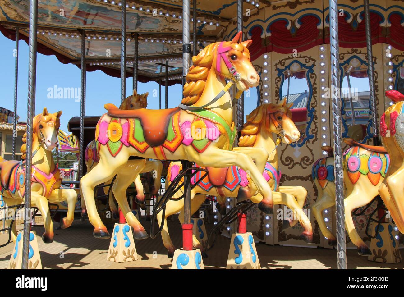 The Wooden Horses on a Fun Fair Carousel Ride Stock Photo - Alamy