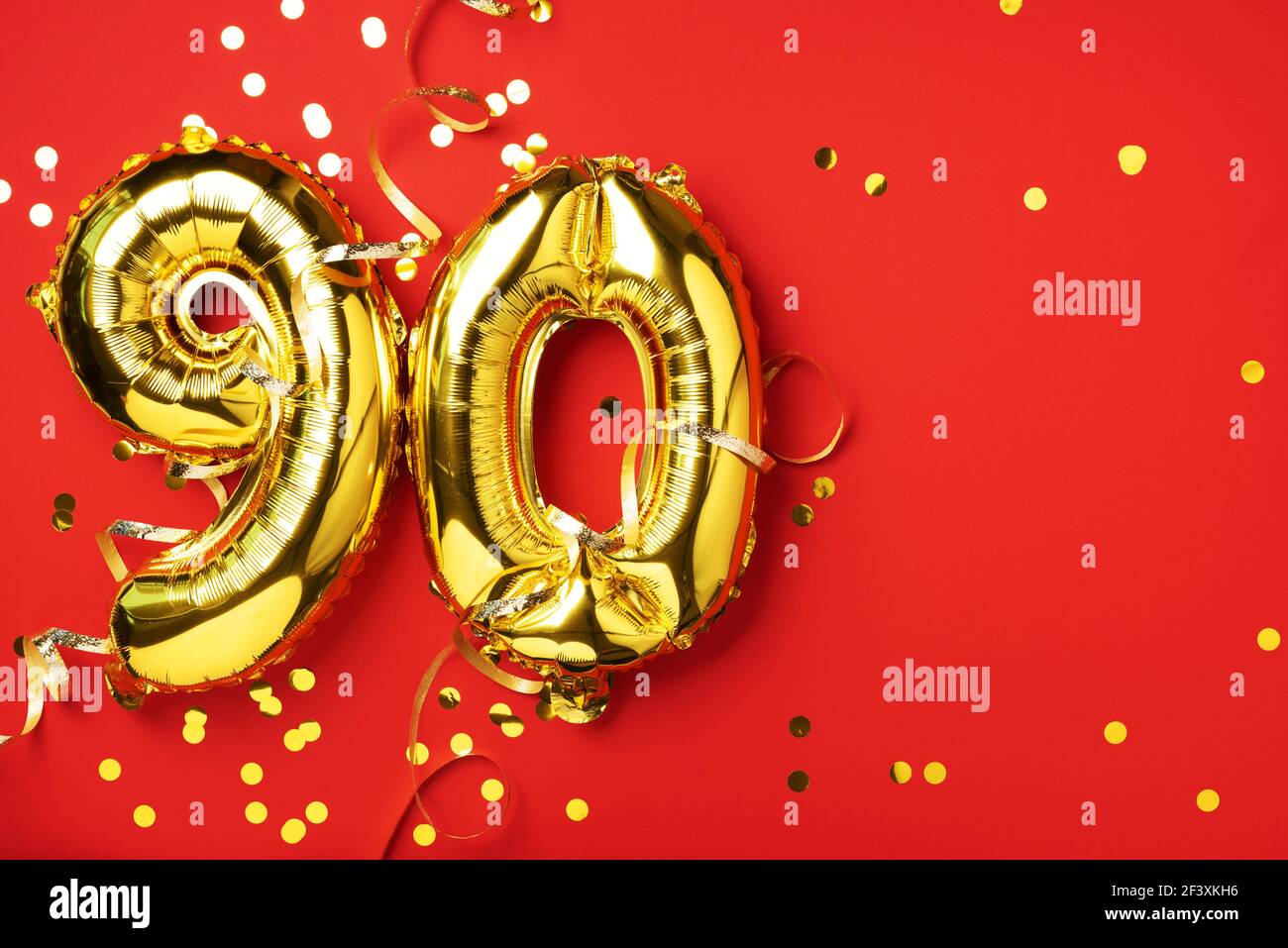 Gold foil balloon number, digit ninety. Birthday greeting card with inscription 90. Anniversary ...