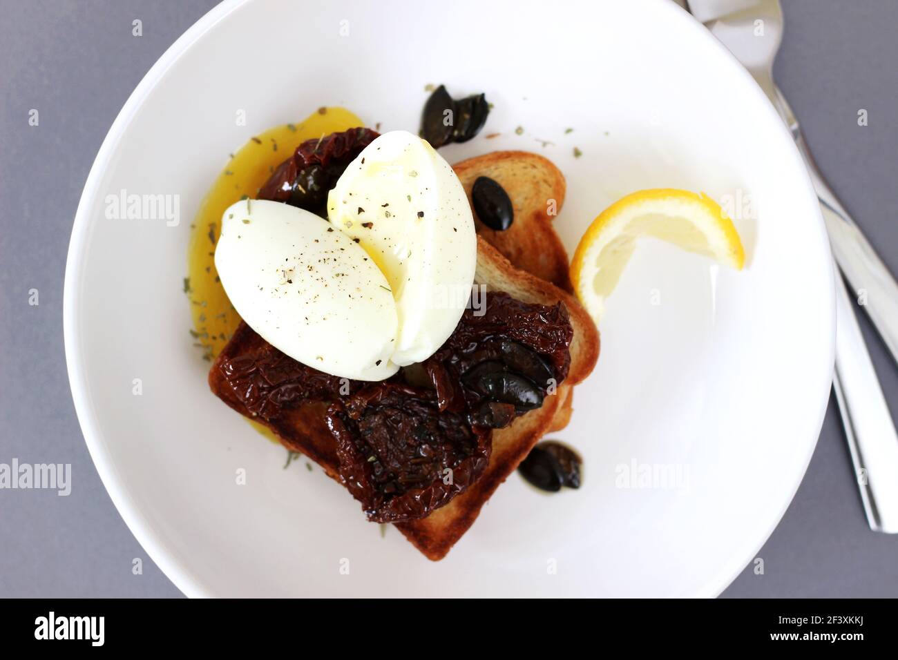 Breakfast Food. Poached Egg with Liquid Yolk on Bread Toast with Dried ...