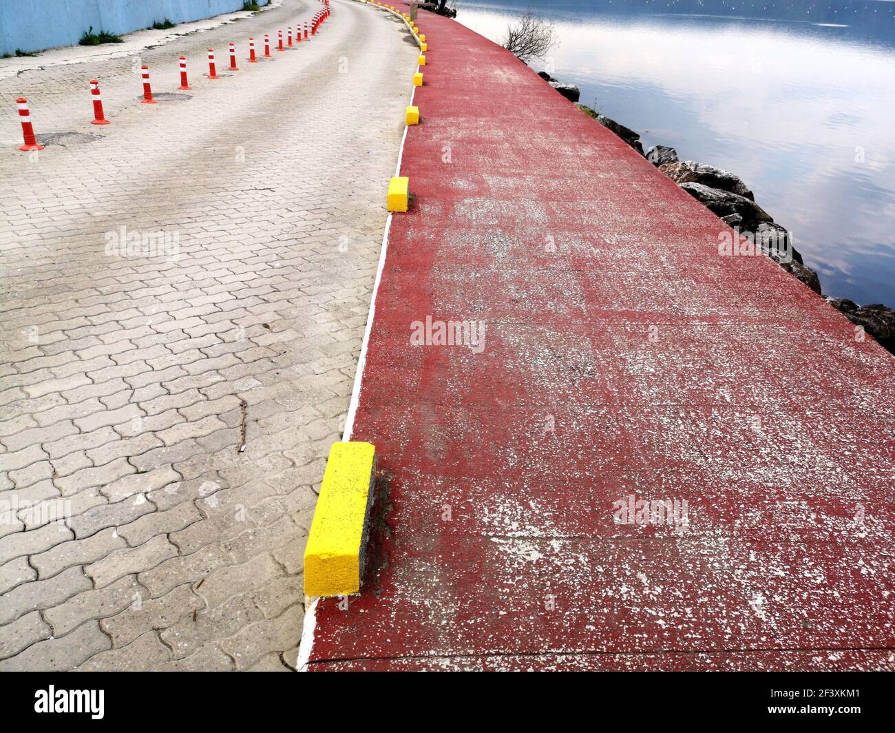 A lakeside footpath pavement sidewalk with traffic signs Stock Photo ...