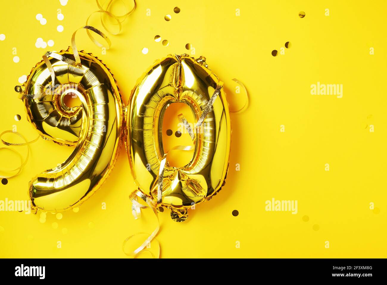 Gold foil balloon number, digit ninety. Birthday greeting card, inscription 90. Anniversary ...