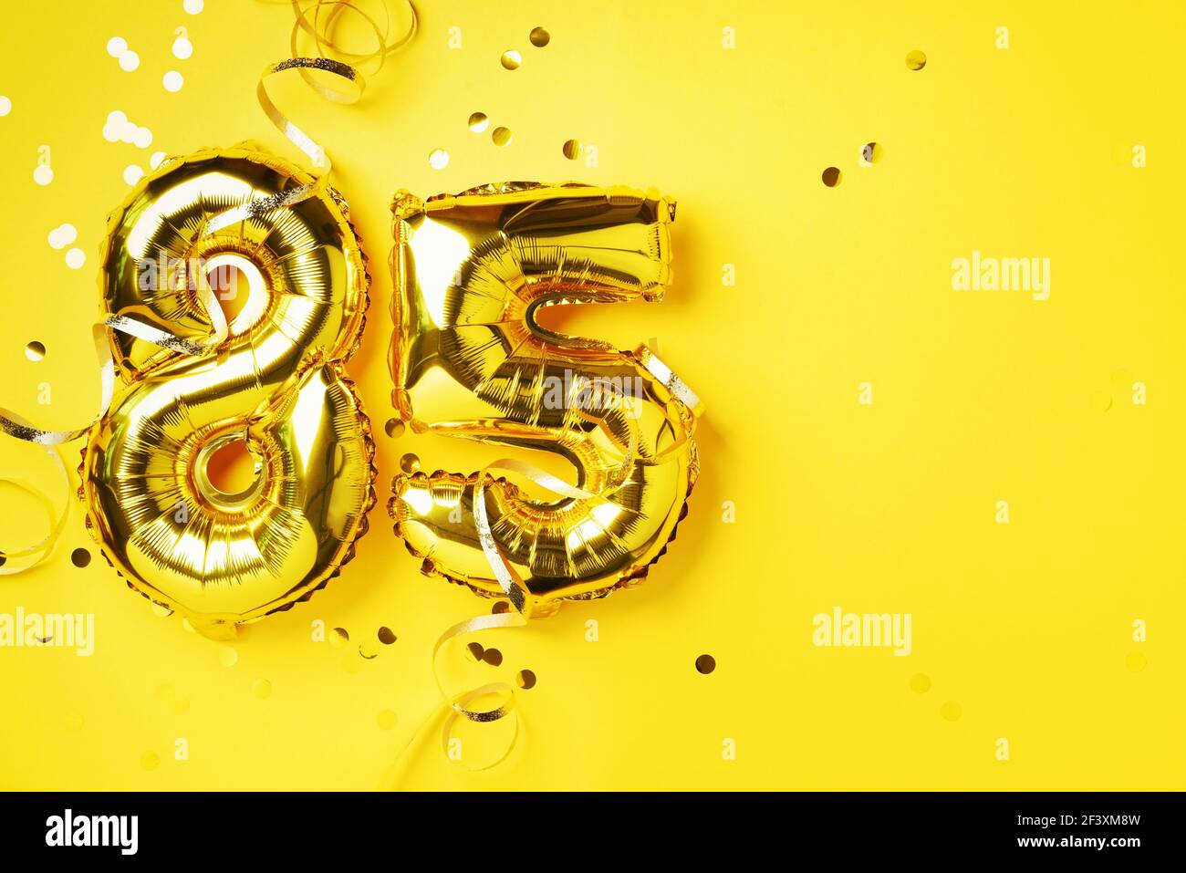 Gold foil balloon number, digit eighty-five. Birthday greeting card ...