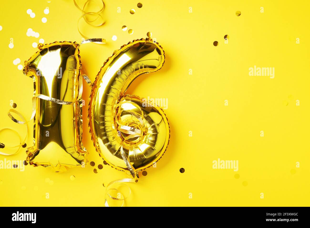 Gold foil balloon number, digit sixteen. Birthday greeting card ...