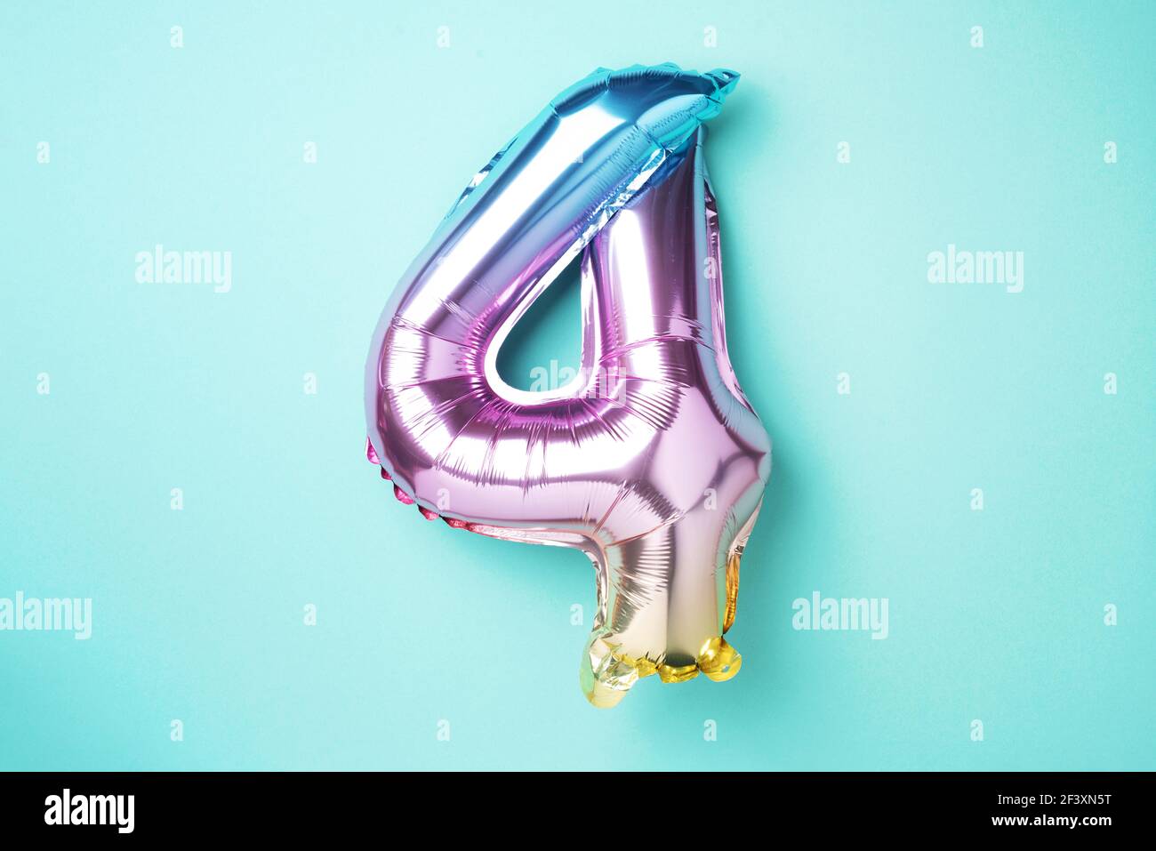 Creative layout. Rainbow foil balloon number and digit four 4. Birthday ...