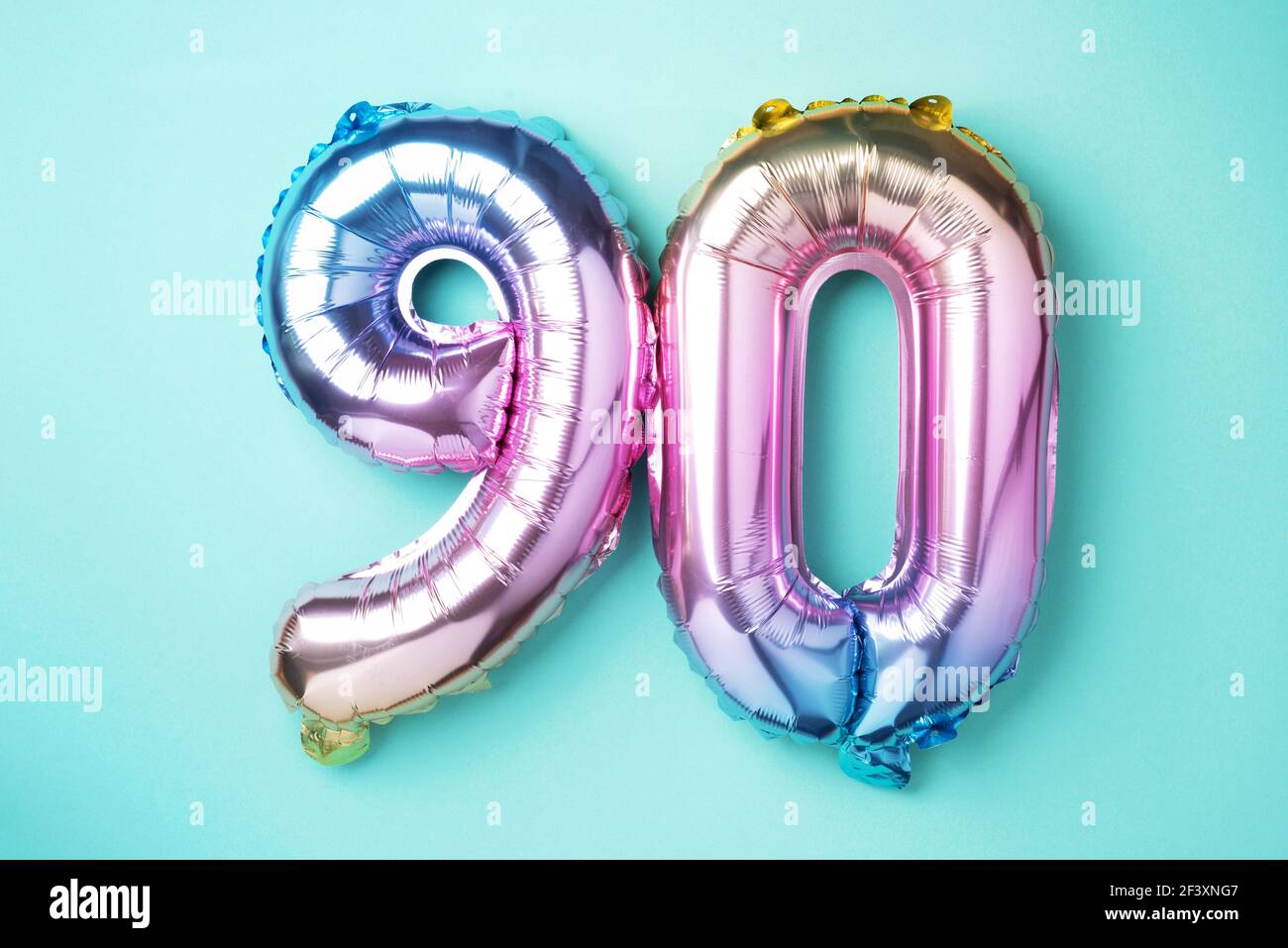 Rainbow foil balloon number, digit ninety. Birthday greeting card with inscription 90 ...