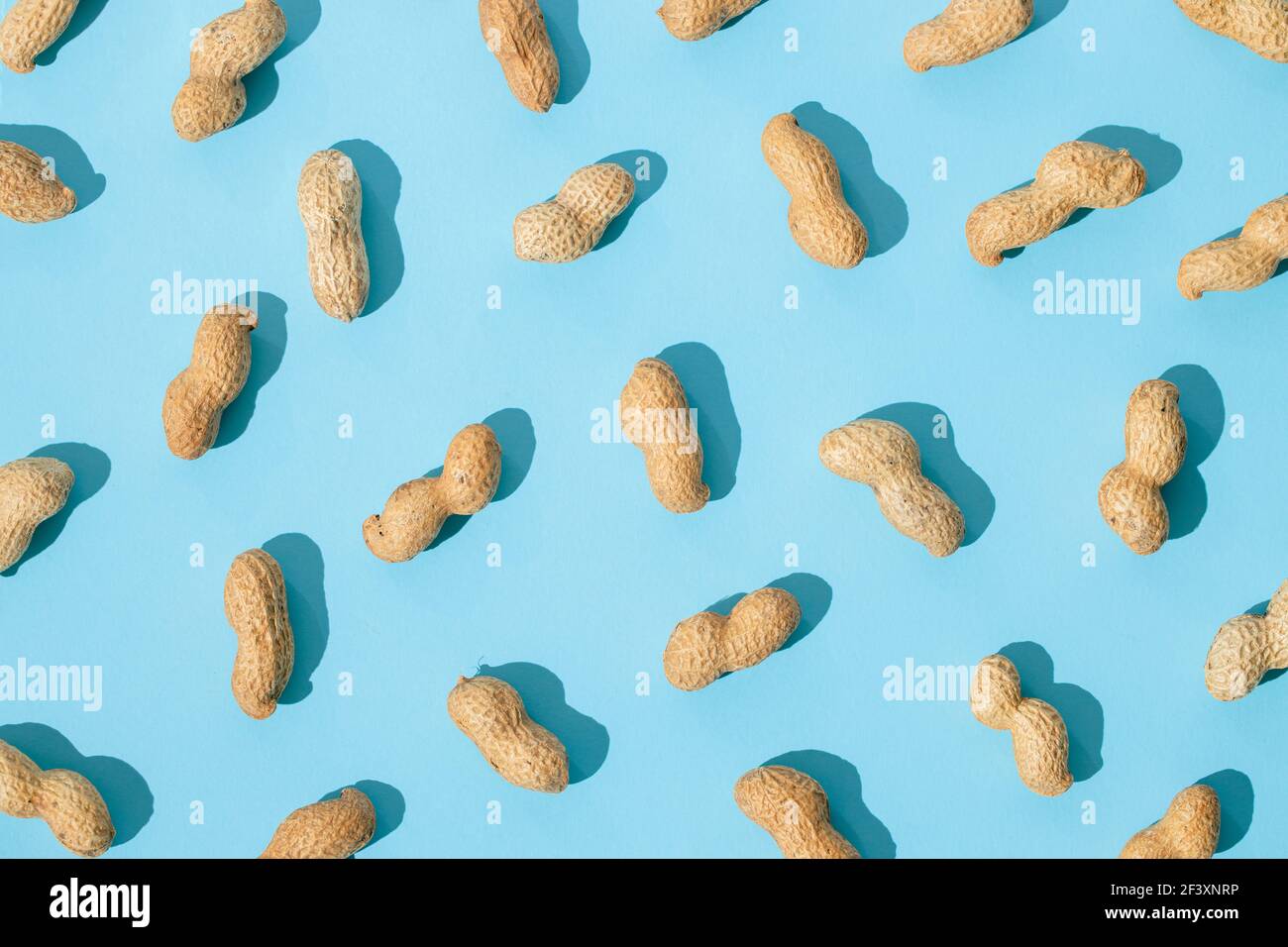 Peanuts pattern on a blue background Stock Photo - Alamy