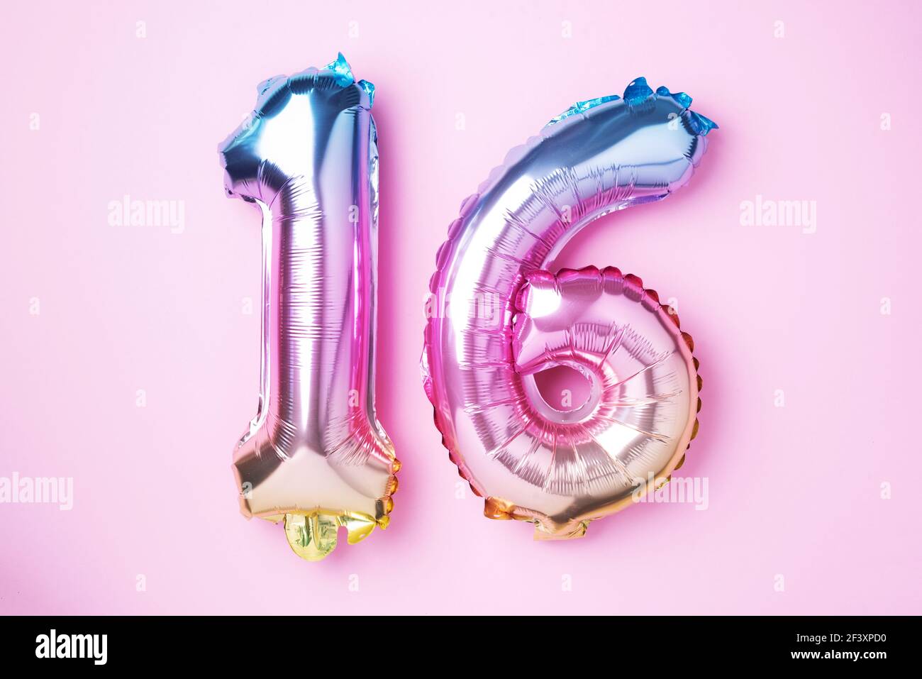 Creative layout. Rainbow foil balloon number, digit sixteen. Birthday ...