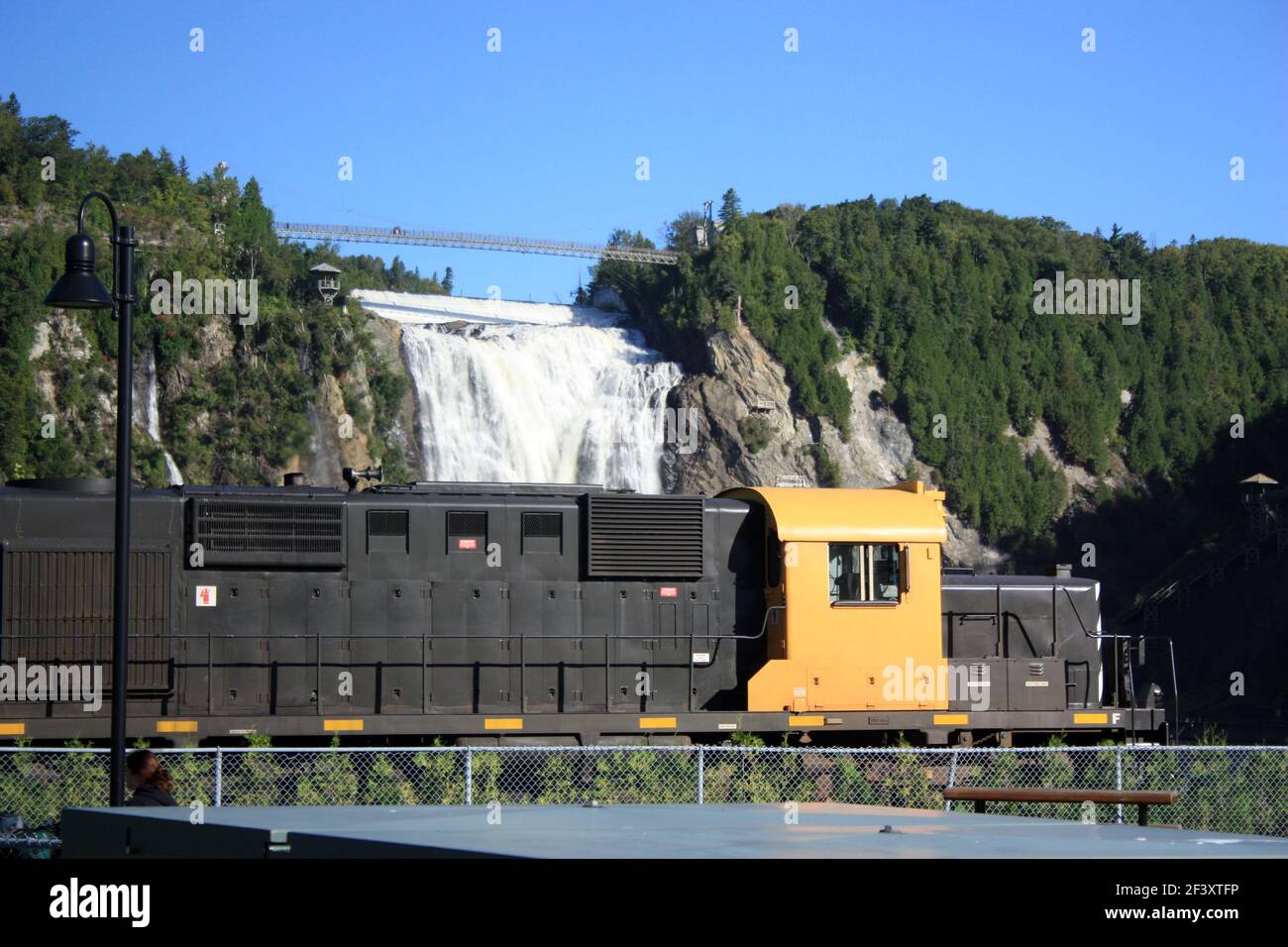 Canadian diesel locomotive in front of the Montmorency Waterfall ...
