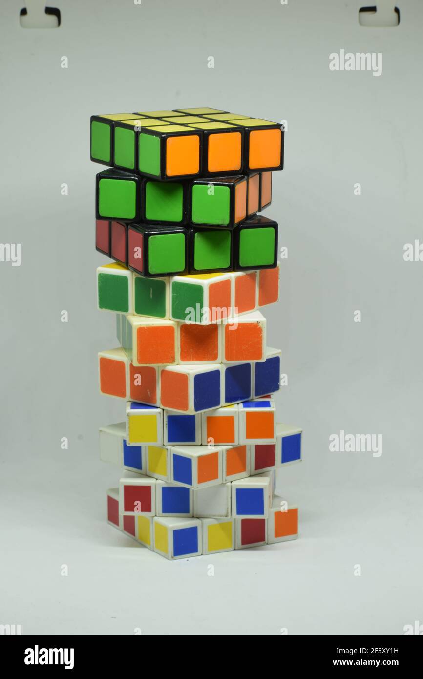 A vertical shot of unsolved Rubik's Cube on a white background Stock Photo - Alamy