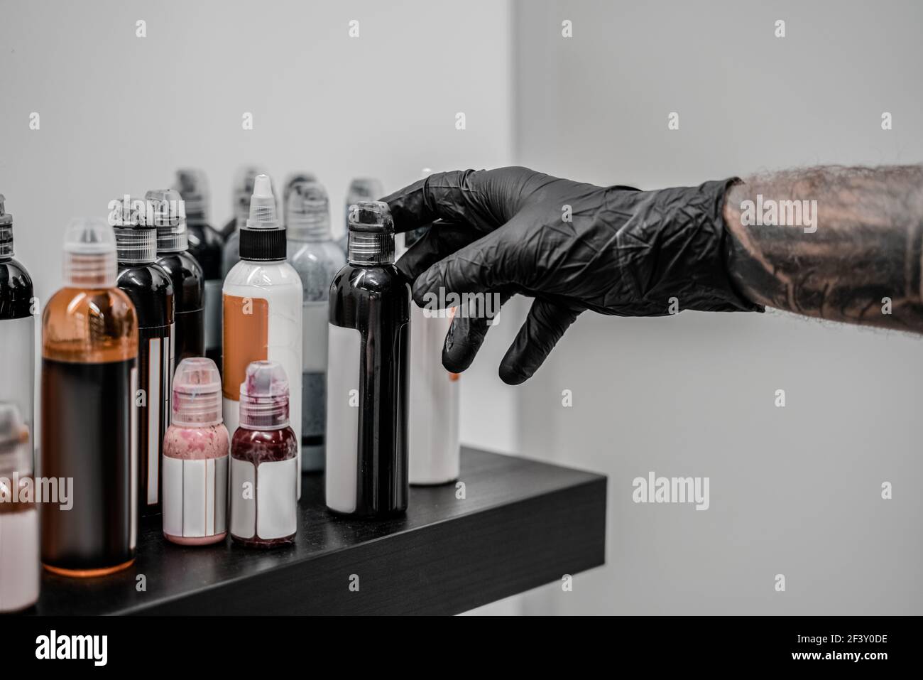 Close-up of tattoo artist work place parts and paint. Professional ...