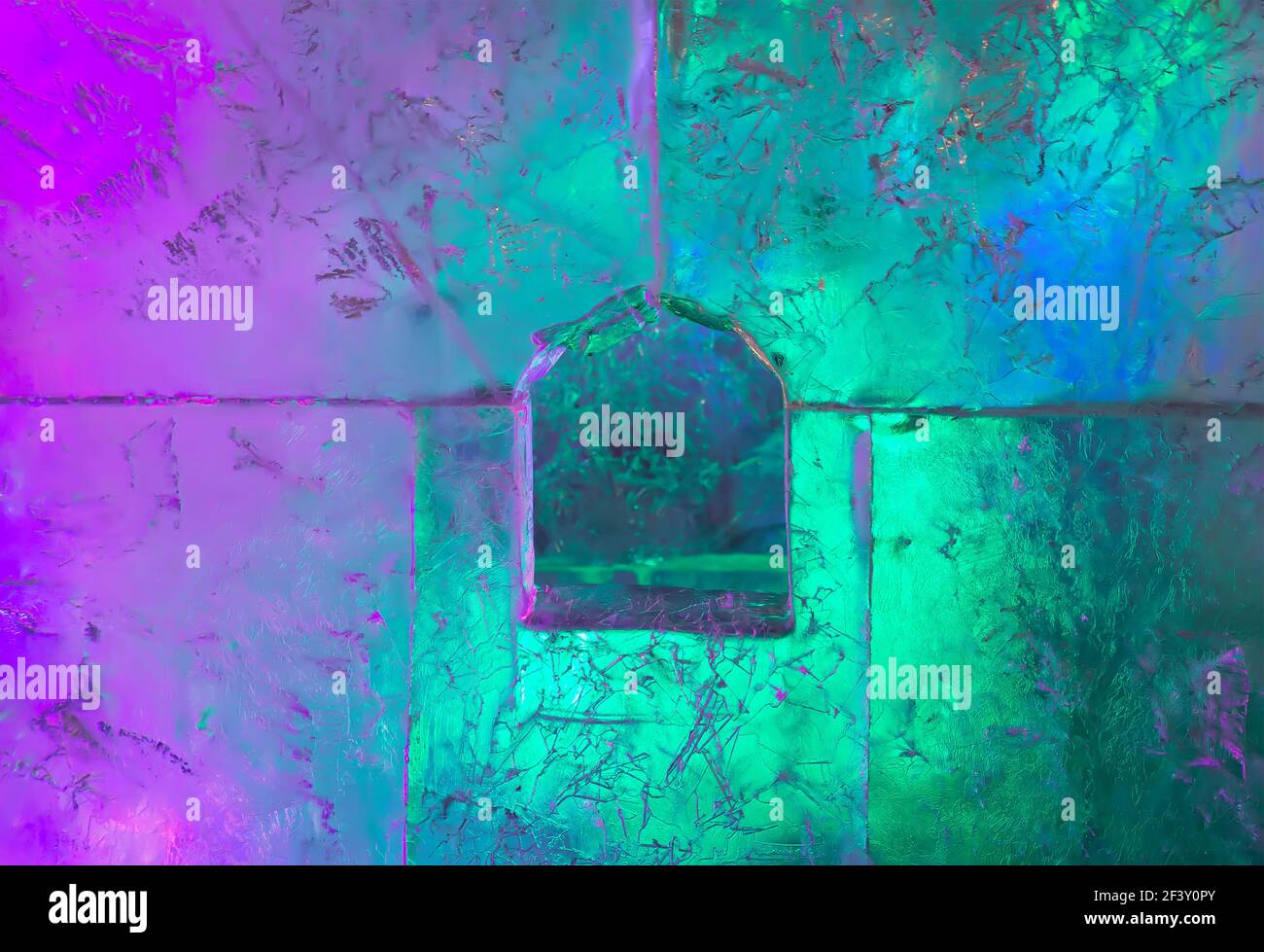 Wall of ice with a window and multi-colored lighting Stock Photo - Alamy