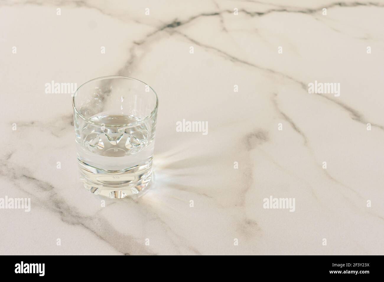 Glass with fresh water on marble table. Space for text Stock Photo - Alamy