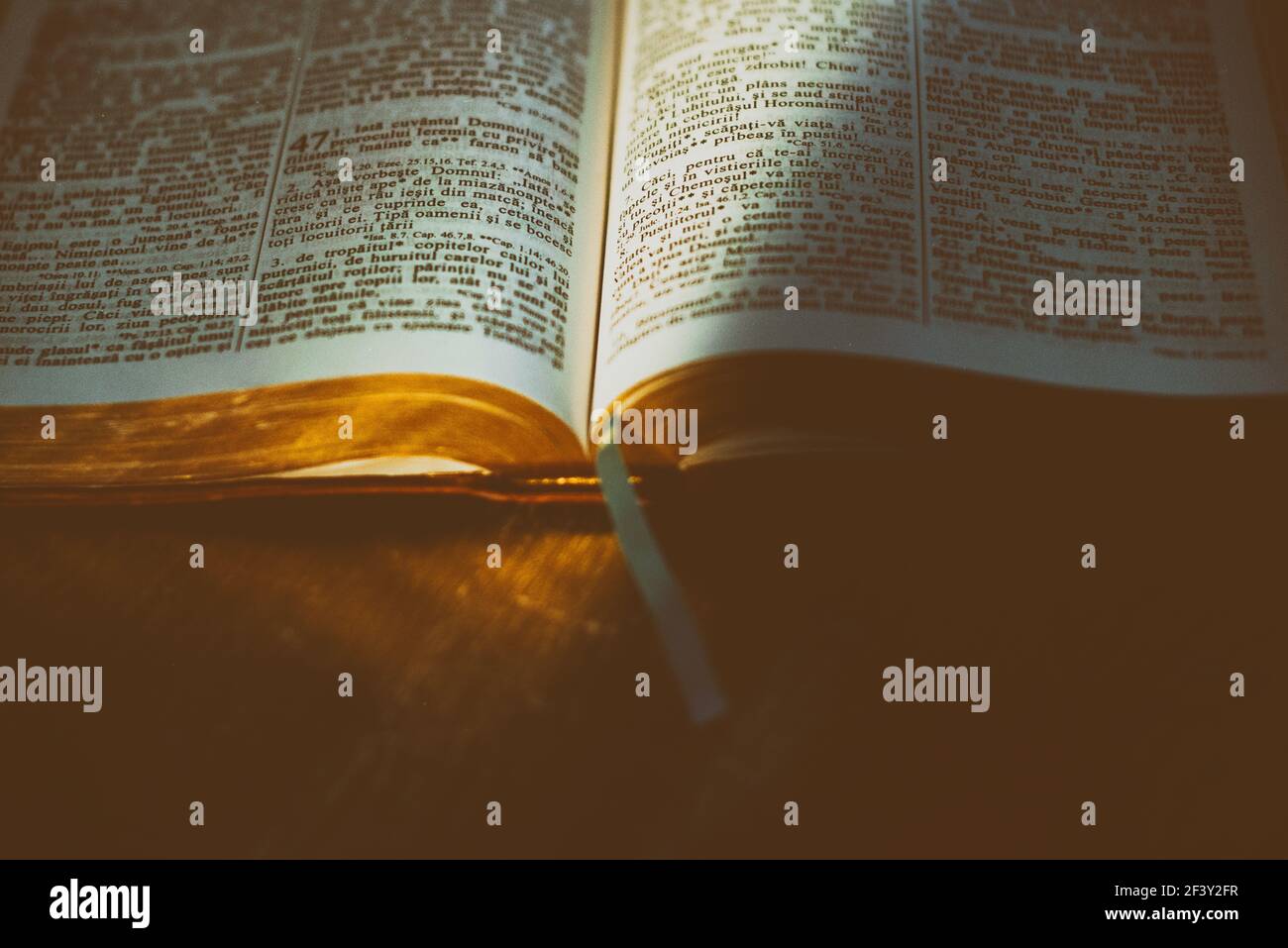 Open bible on a wood table Stock Photo - Alamy