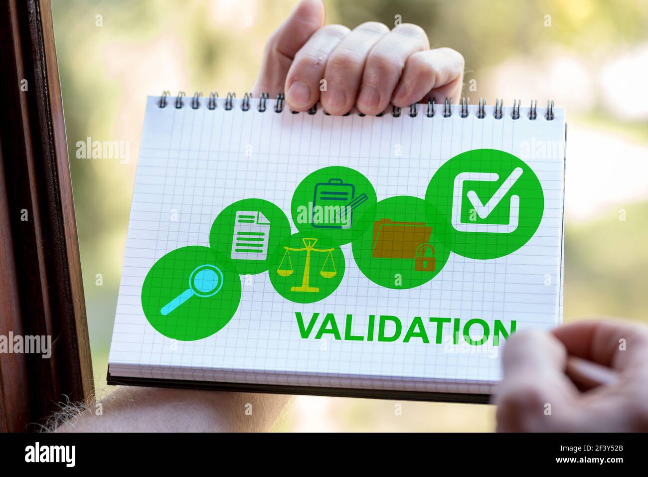 Hand drawing validation concept on a notepad Stock Photo - Alamy