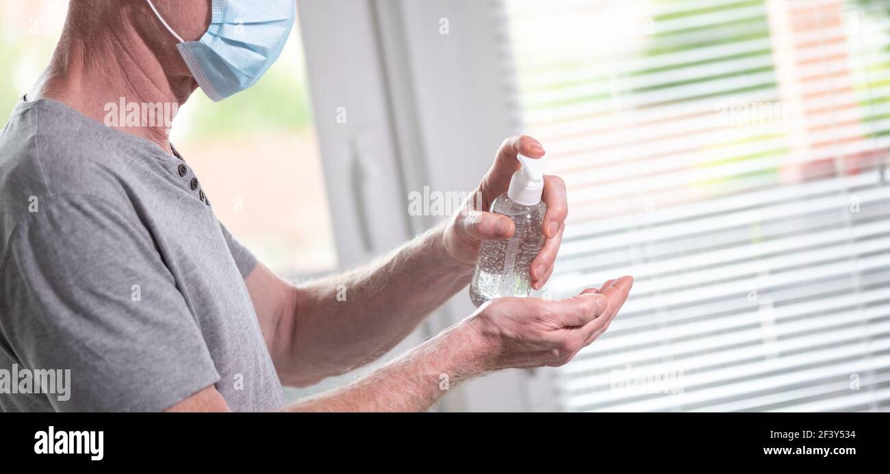 Man using hand sanitizer alcohol gel; prevention of virus and bacteria ...