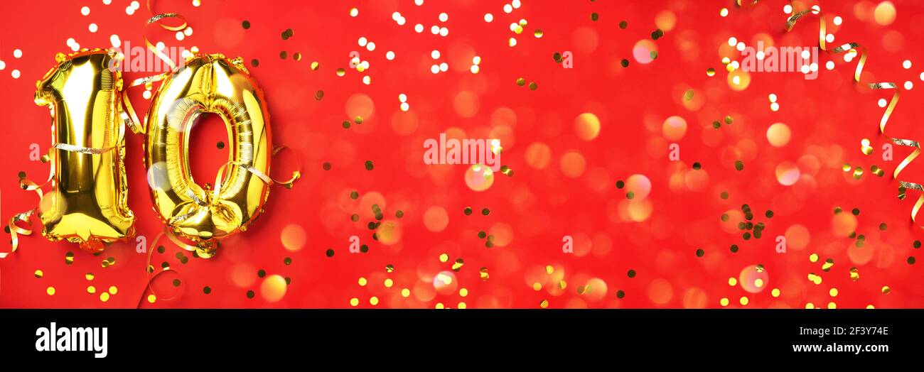 Gold foil balloon number, digit ten. Birthday greeting card with ...