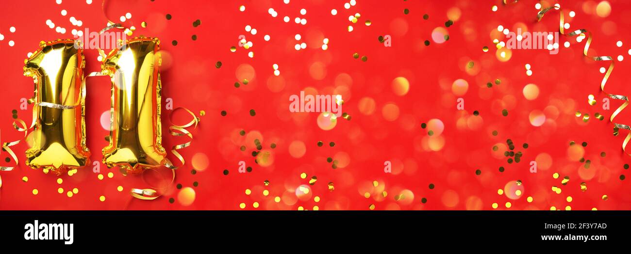 Gold foil balloon number, digit eleven. Birthday greeting card ...