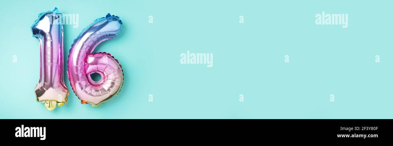 Creative layout. Rainbow foil balloon number, digit sixteen. Birthday ...