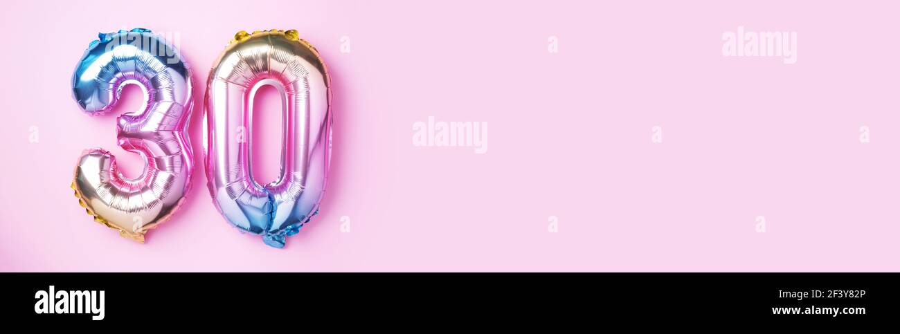 Rainbow foil balloon number, digit thirty. Birthday greeting card with ...