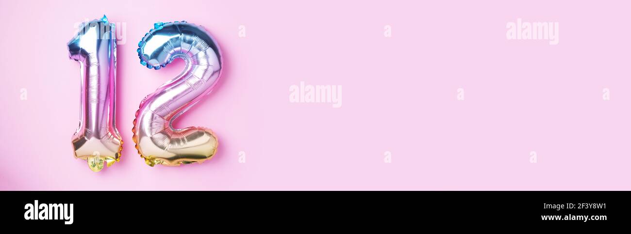 Creative layout. Rainbow foil balloon number, digit twelve. Birthday ...