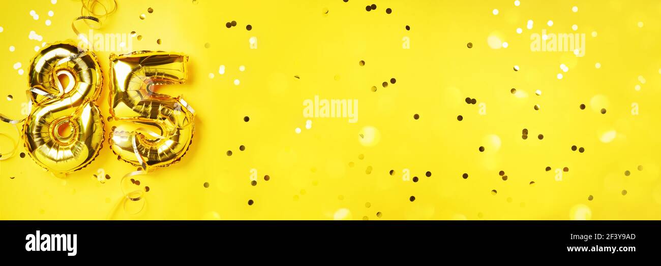 Gold foil balloon number, digit eighty-five. Birthday greeting card ...