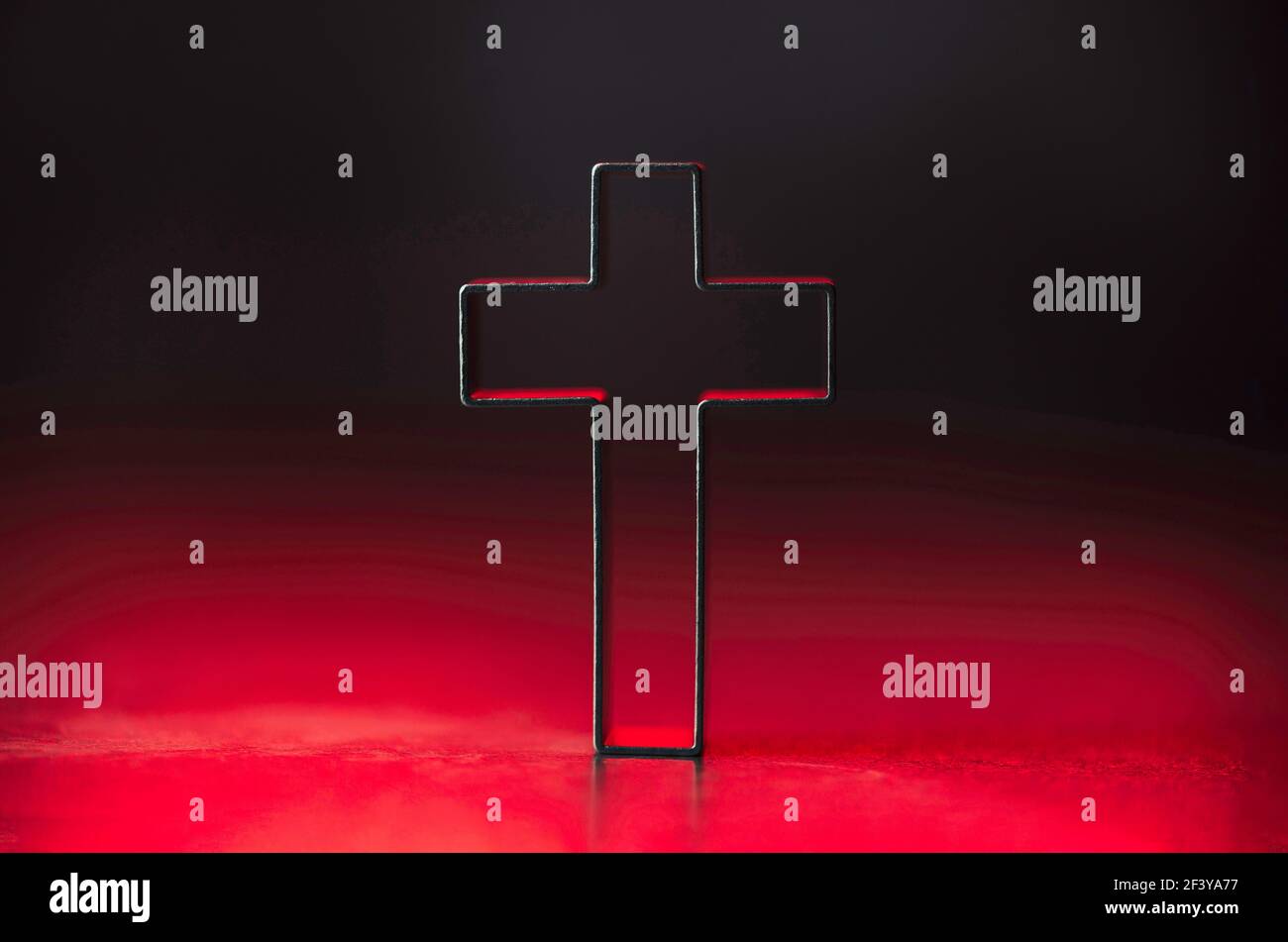 Christian cross on red background with soft bokeh lights background ...