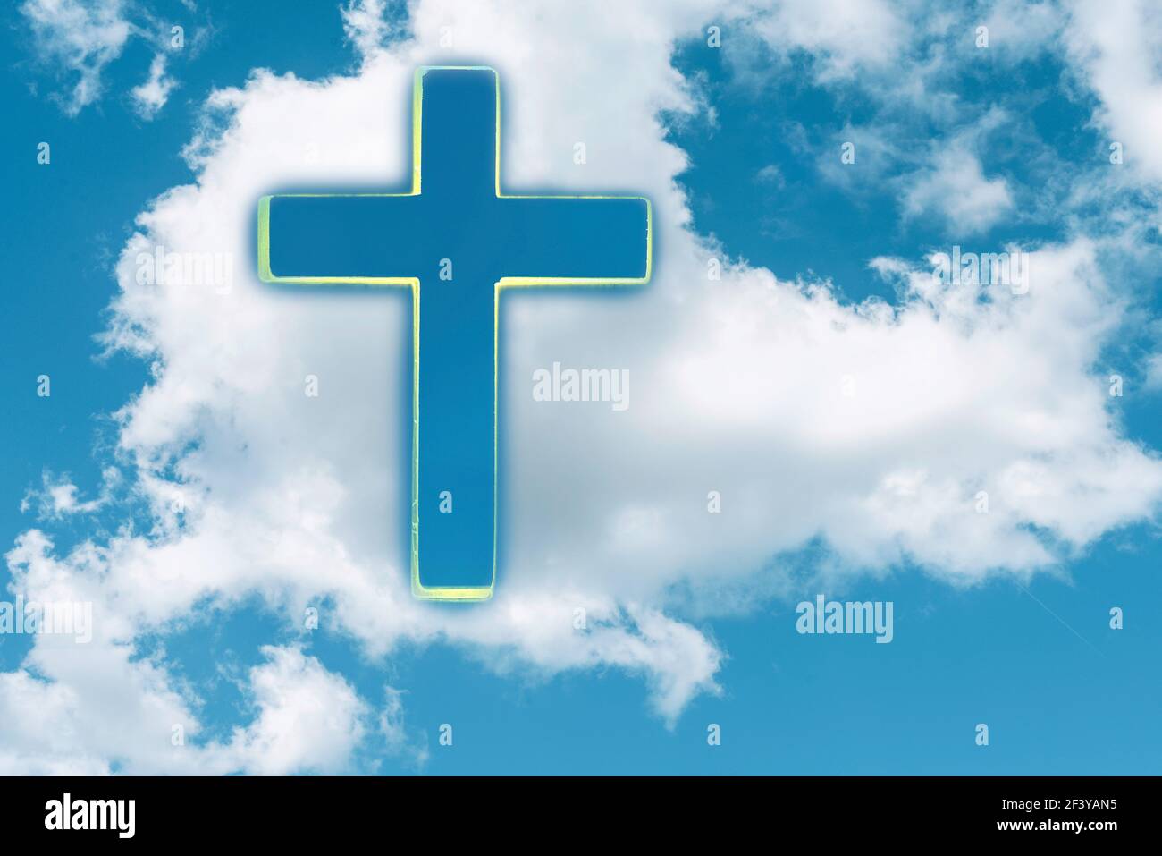Gate to heaven. Shining cross in clouds on blue sky. Copy space ...