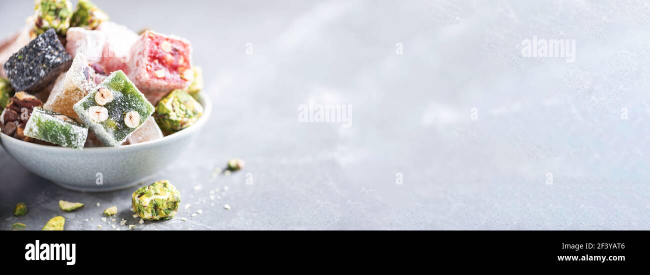 Middle Eastern sweets on blue background. Arab dessert, baklava, halva ...