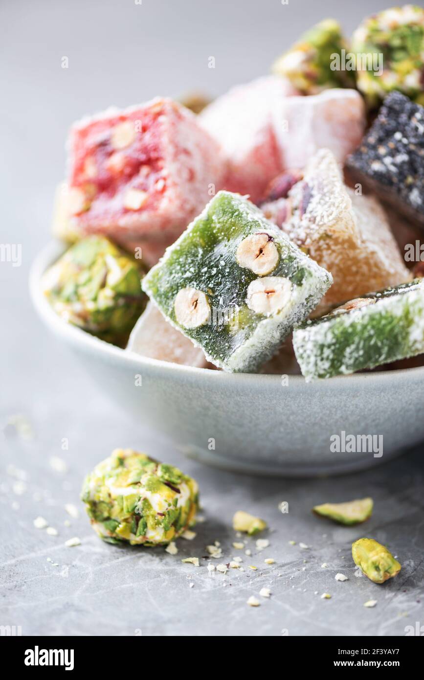 Traditional turkish delight on grey background. Arab dessert, baklava ...
