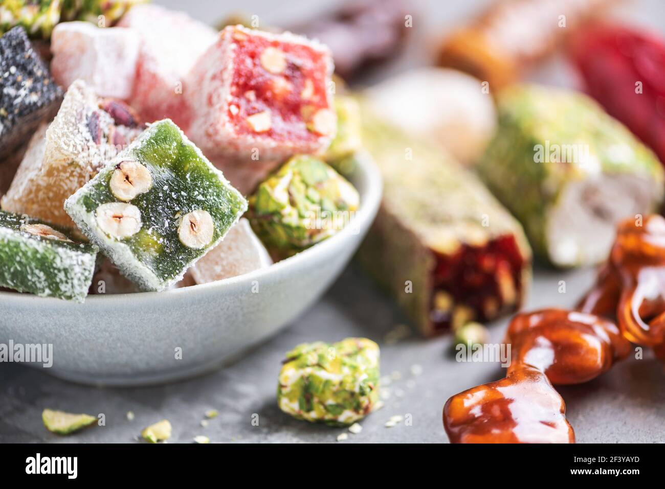 Middle Eastern sweets on blue background. Arab dessert, baklava, halva ...