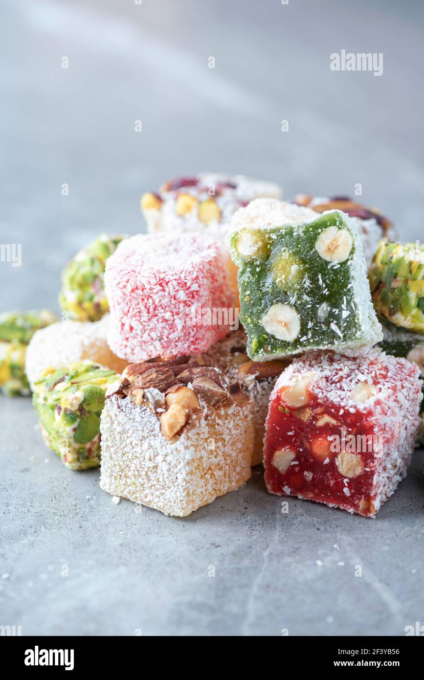 Turkish delight with pistachios on grey background. Copy space ...