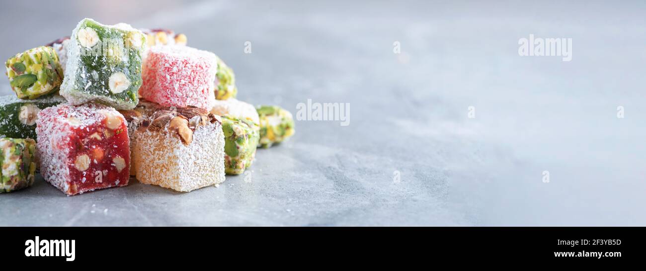 Middle Eastern sweets on blue background. Arab dessert, baklava, halva ...