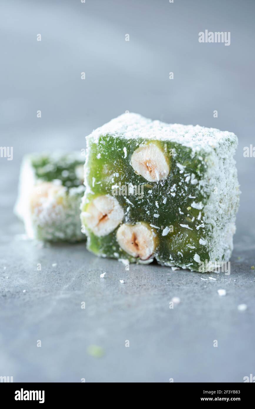 Turkish delight with hazelnuts on grey background. Copy space ...