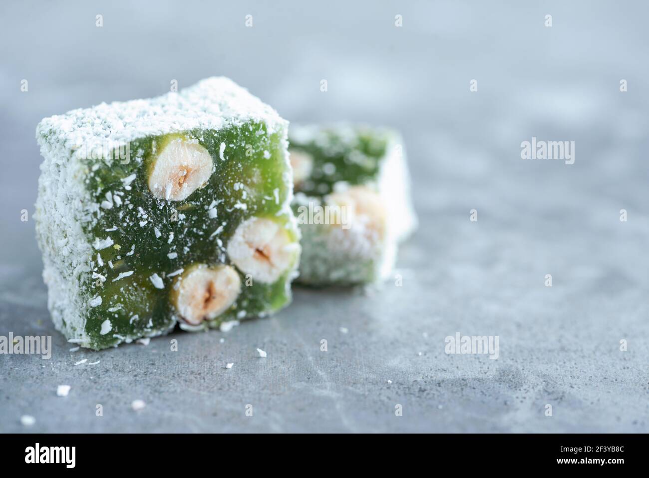 Turkish delight with hazelnuts on grey background. Copy space ...