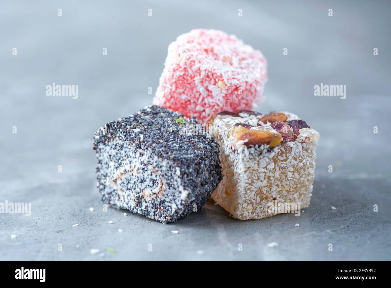 Turkish delight with poppy on grey background. Copy space. Traditional ...