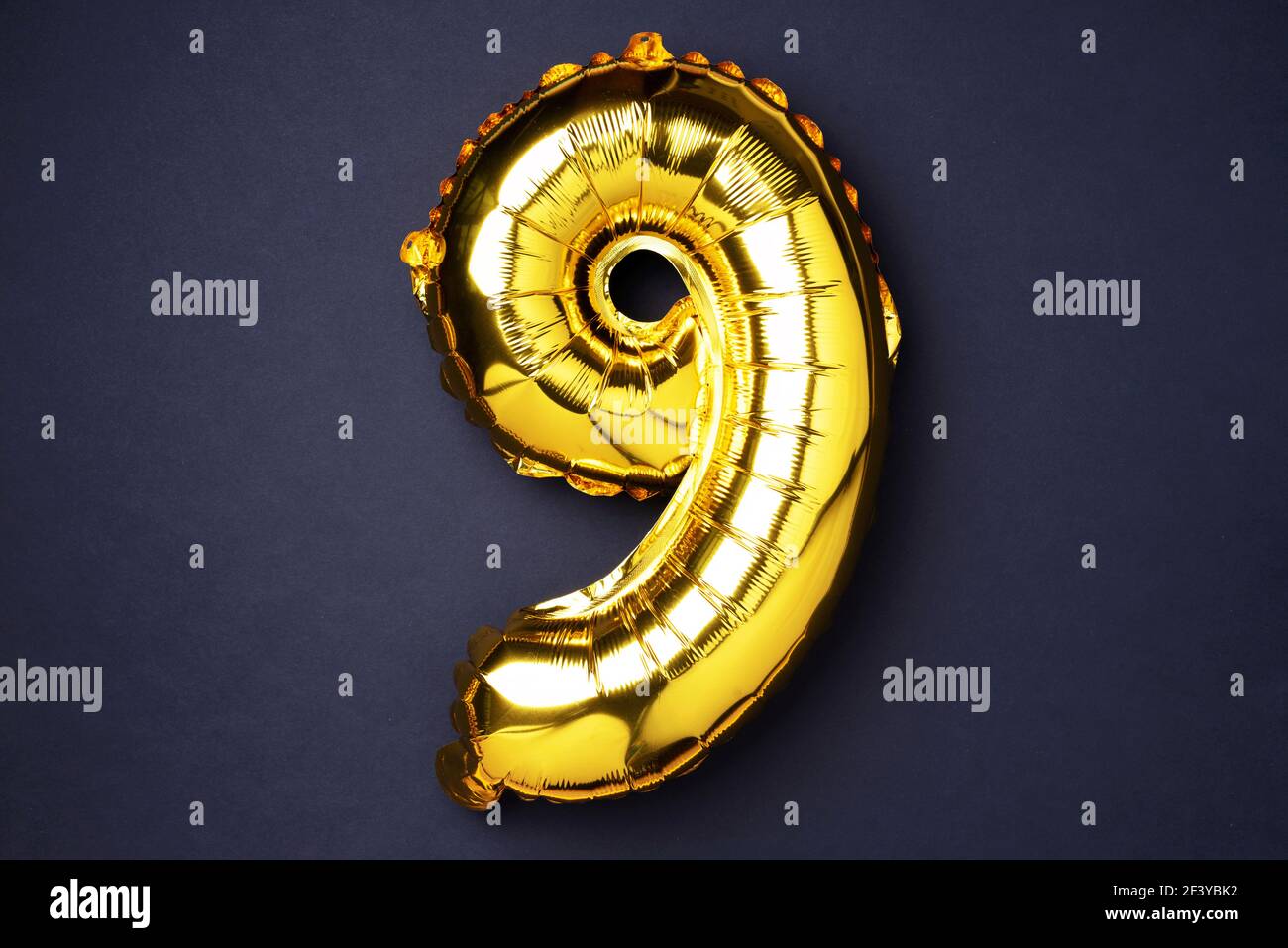 Creative layout. Golden foil balloon number and digit nine 9. Birthday ...